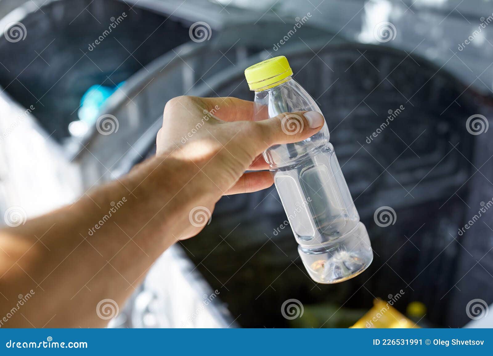 Throw a Plastic Bottle in the Trash, Taking Care of Cleanliness Stock ...