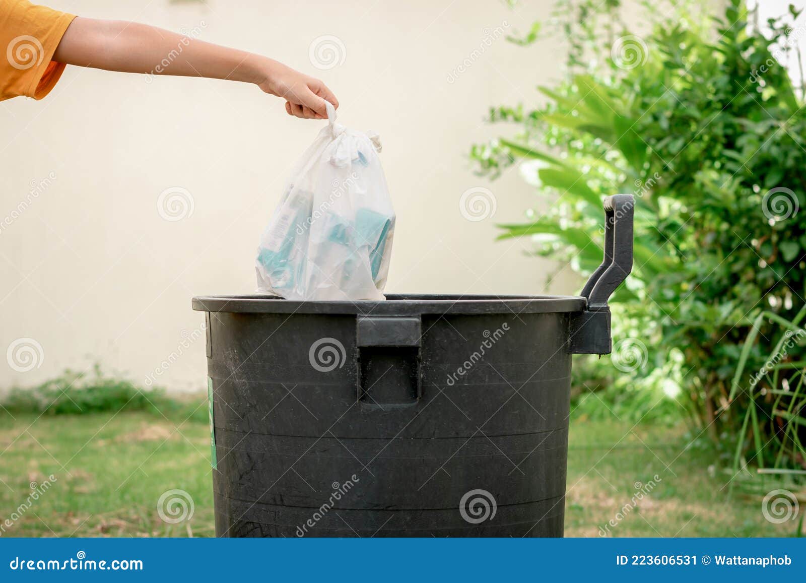 Throw Trash in Plastic Bags into the Trash in the Garden Stock Image ...