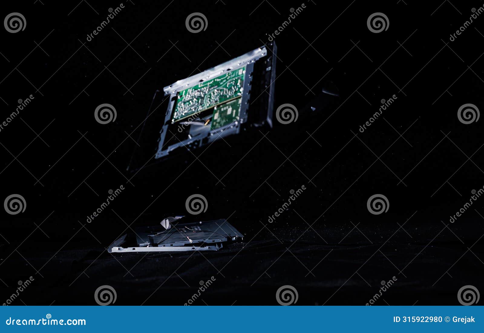 Throwing and Breaking a Screen into Pieces Isolated on a Black Backdrop ...