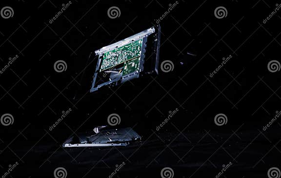 Throwing and Breaking a Screen into Pieces Isolated on a Black Backdrop ...