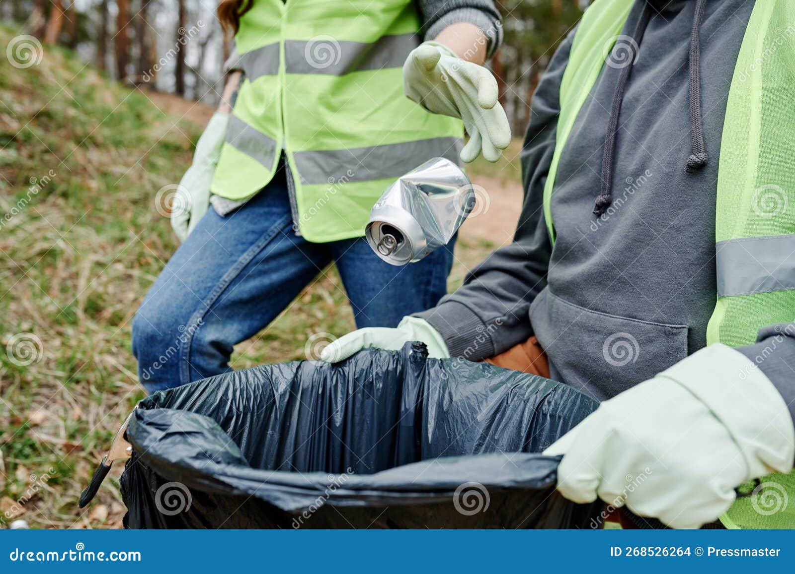 Throwing Can in Garbage Bag Stock Photo - Image of people, woods: 268526264