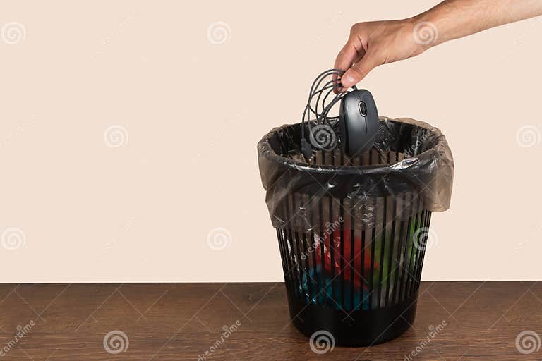 Throwing a Computer Mouse in the Trash Bin, a Computer Mouse in Hand in ...