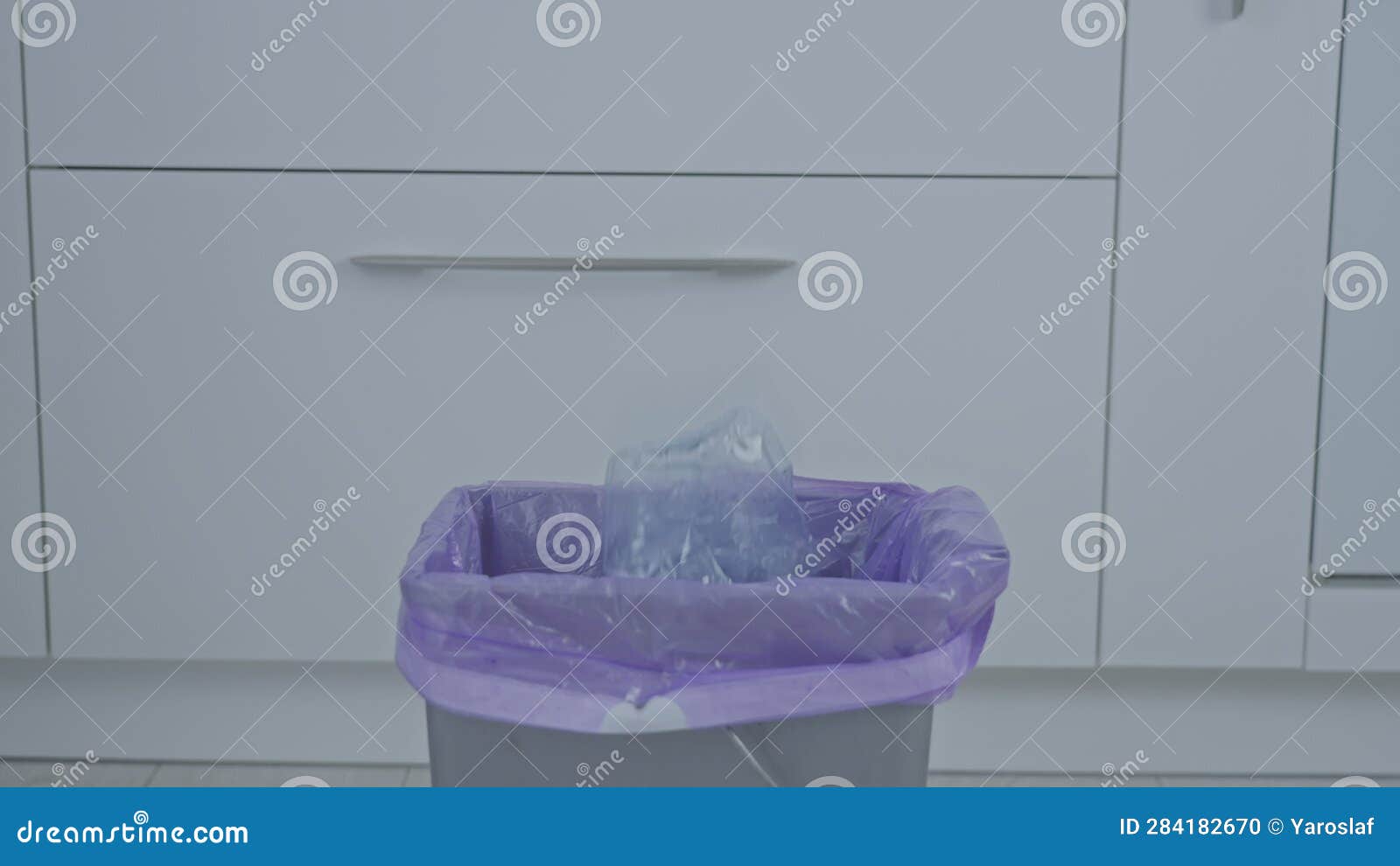 Throwing Empty Plastic Bottle into Trash Bin in Kitchen Stock Footage ...