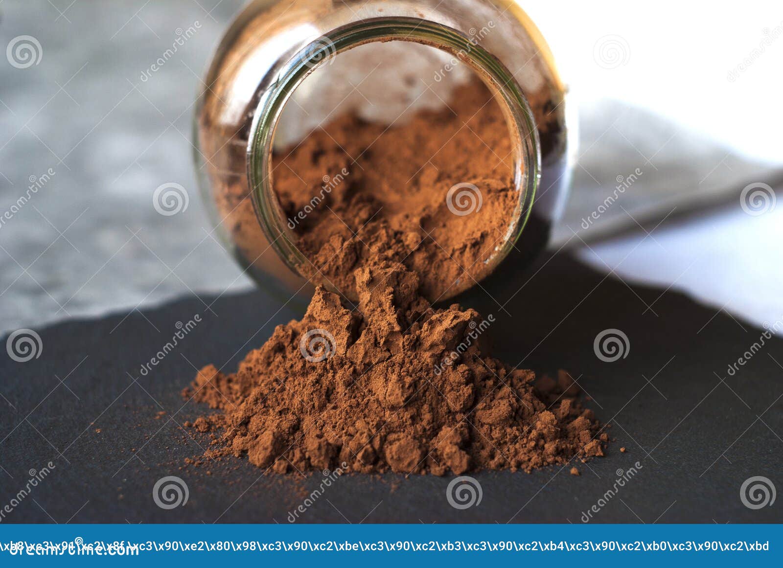 Throwing a Jar of Sprinkled Cocoa Powder on a Board Stock Photo - Image ...