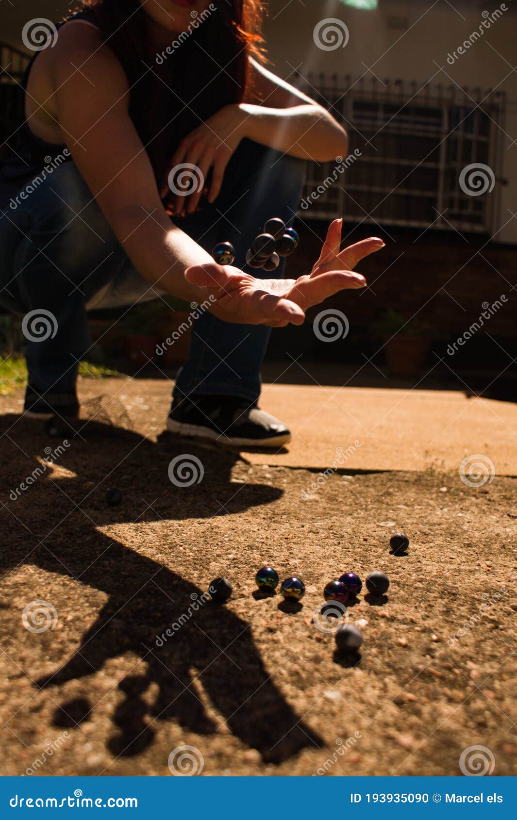 Throwing Marbles in the Air Stock Photo - Image of marbles, play: 193935090