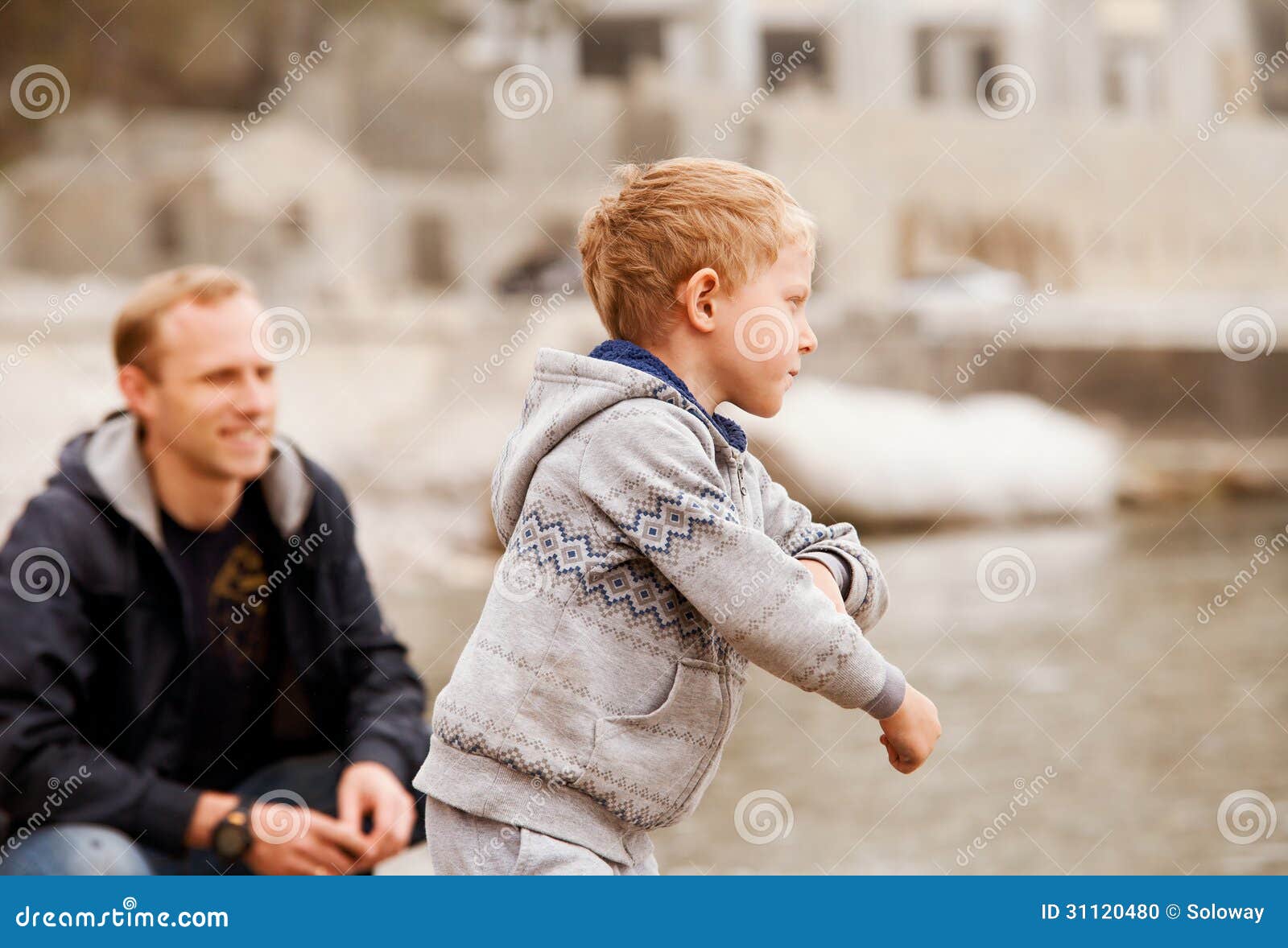 Throwing pebbles boy stock photo. Image of beach, male - 31120480