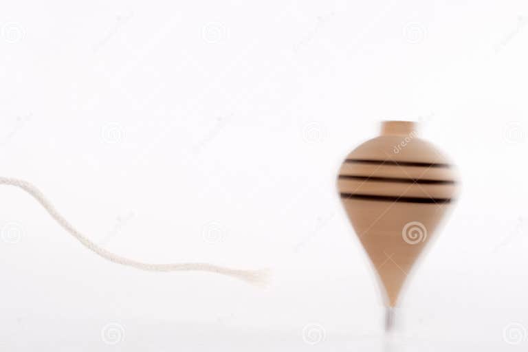 Throwing a spinning top stock photo. Image of throwing - 33478616