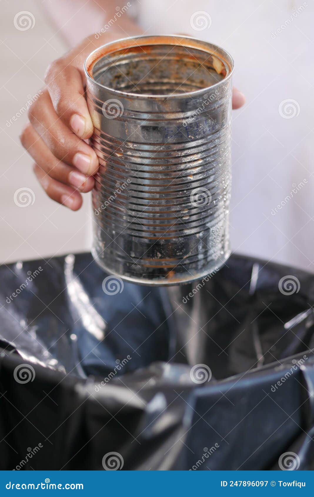 Throwing Tin Container in a Garbage Bin Stock Image - Image of silver ...