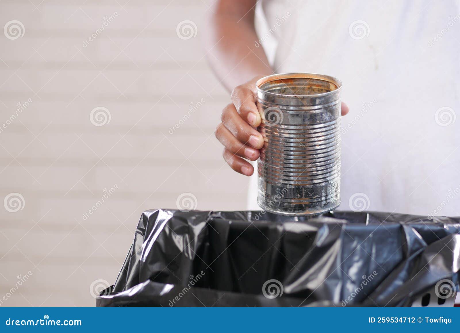 Throwing Tin Container in a Garbage Bin Stock Photo - Image of ...