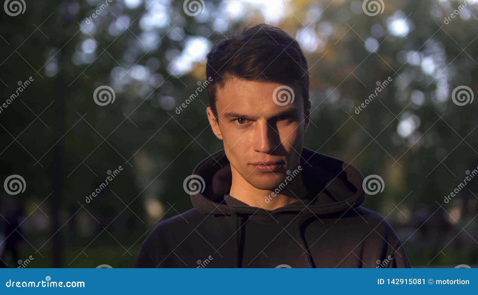 Thug Looking at Camera with Anger, Expressing Aggression and Danger ...