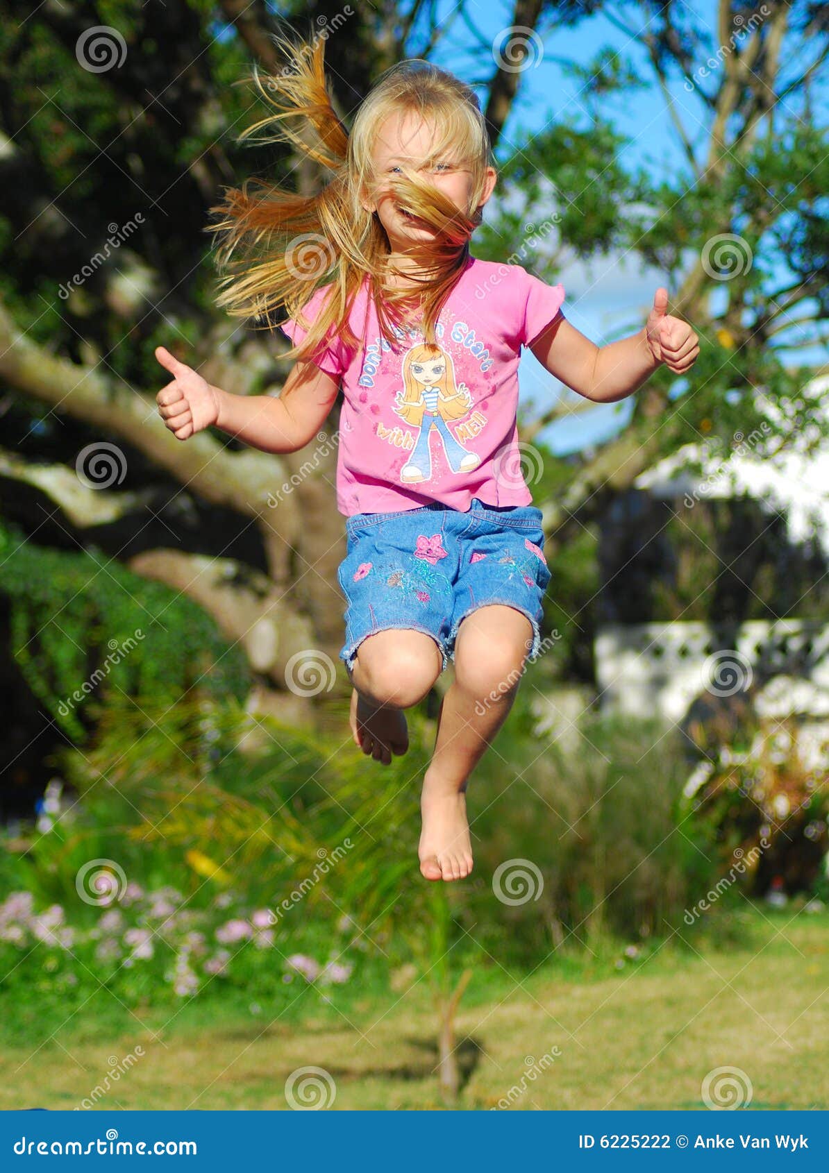 Child jump with thumbs up stock photo. Image of barefoot - 6225222