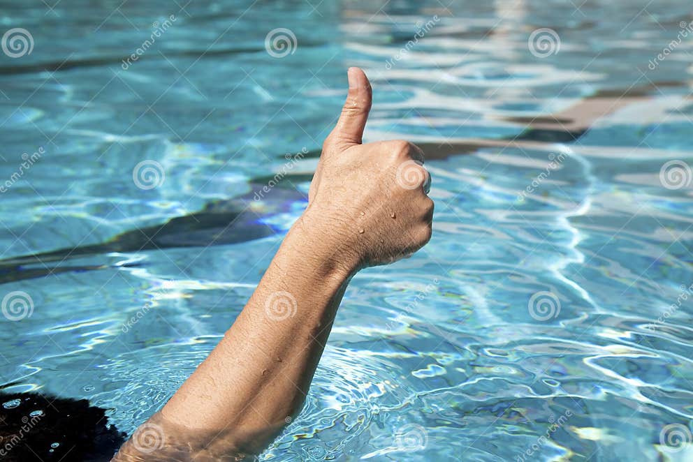 Thumb up in the water stock photo. Image of successful - 20722010