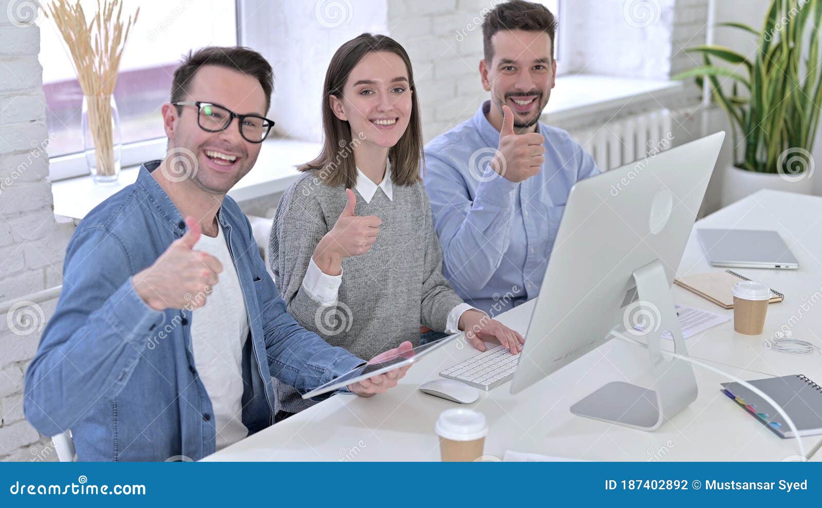 Thumbs Up by Creative People in Modern Office Stock Photo - Image of ...