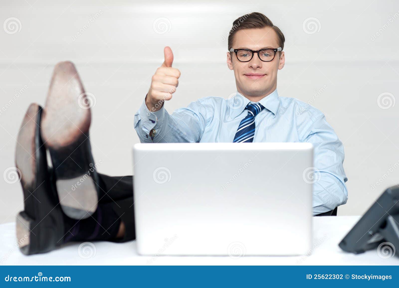 Thumbs Up Guy Relaxing with Legs on Work Desk Stock Photo - Image of ...