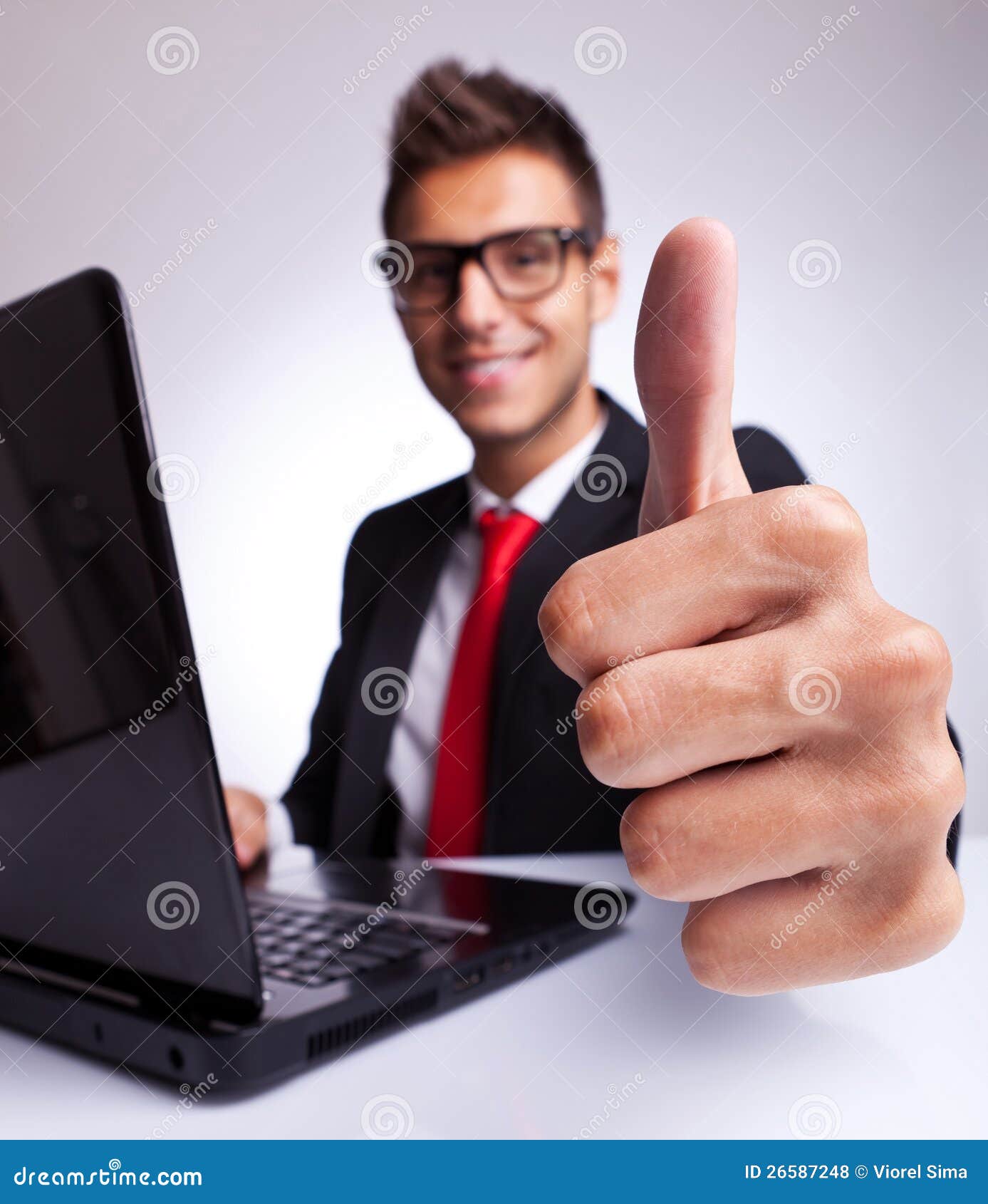 Thumbs up at office desk stock photo. Image of company - 26587248