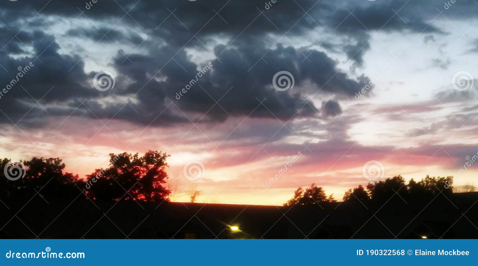Thundercloud Invading the Sunset Stock Photo - Image of sunlight ...