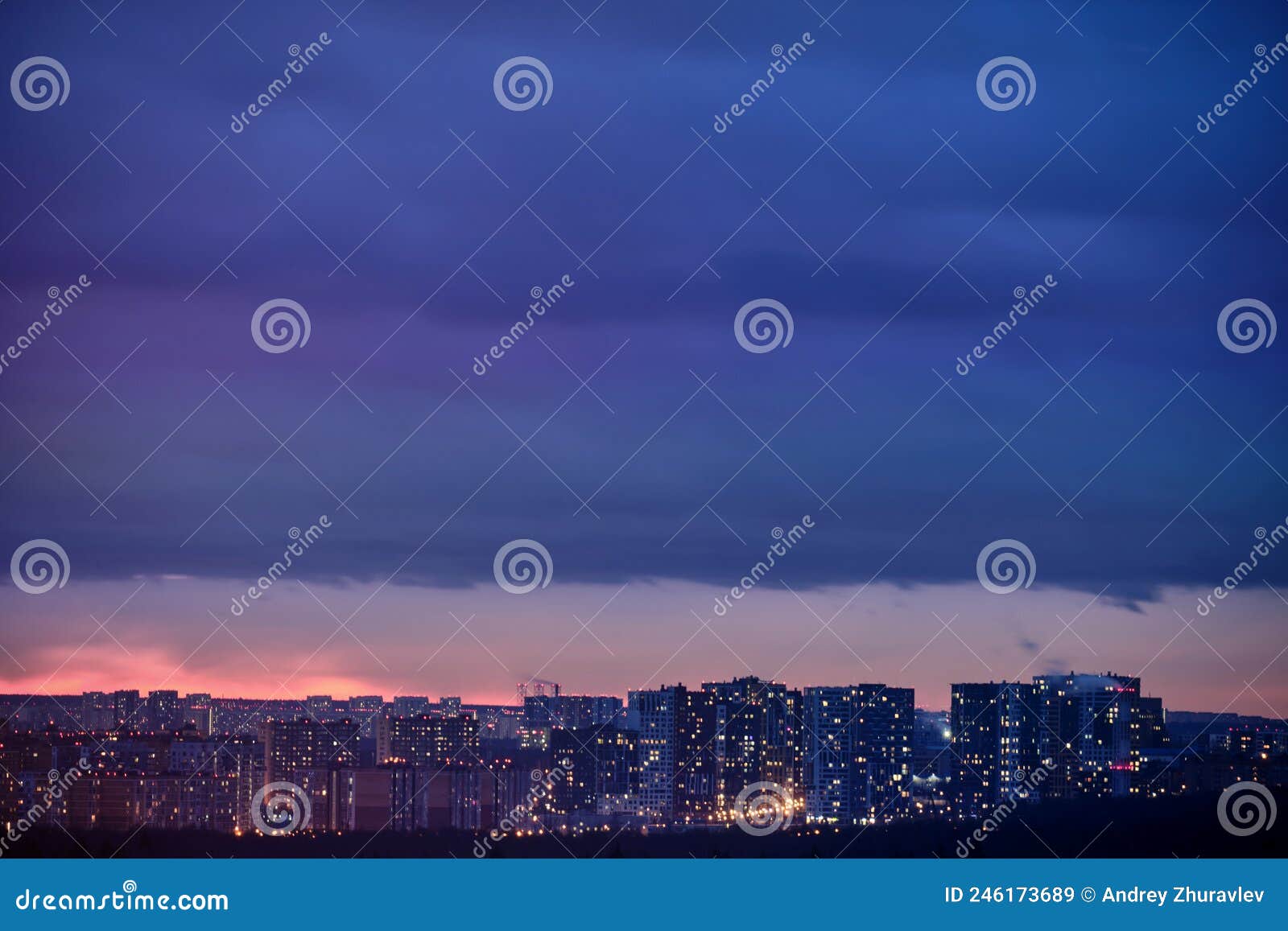 Thunderclouds Over a Dark City at Night with High-rise Buildings ...