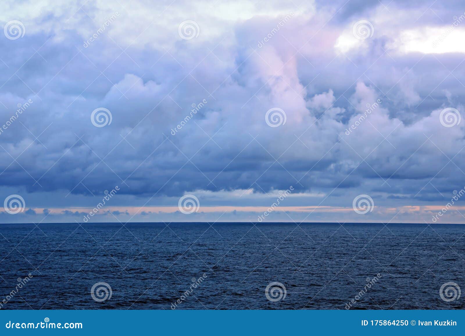 Thunderclouds and Rain Clouds Over the Sea Horizon and the Surface of ...