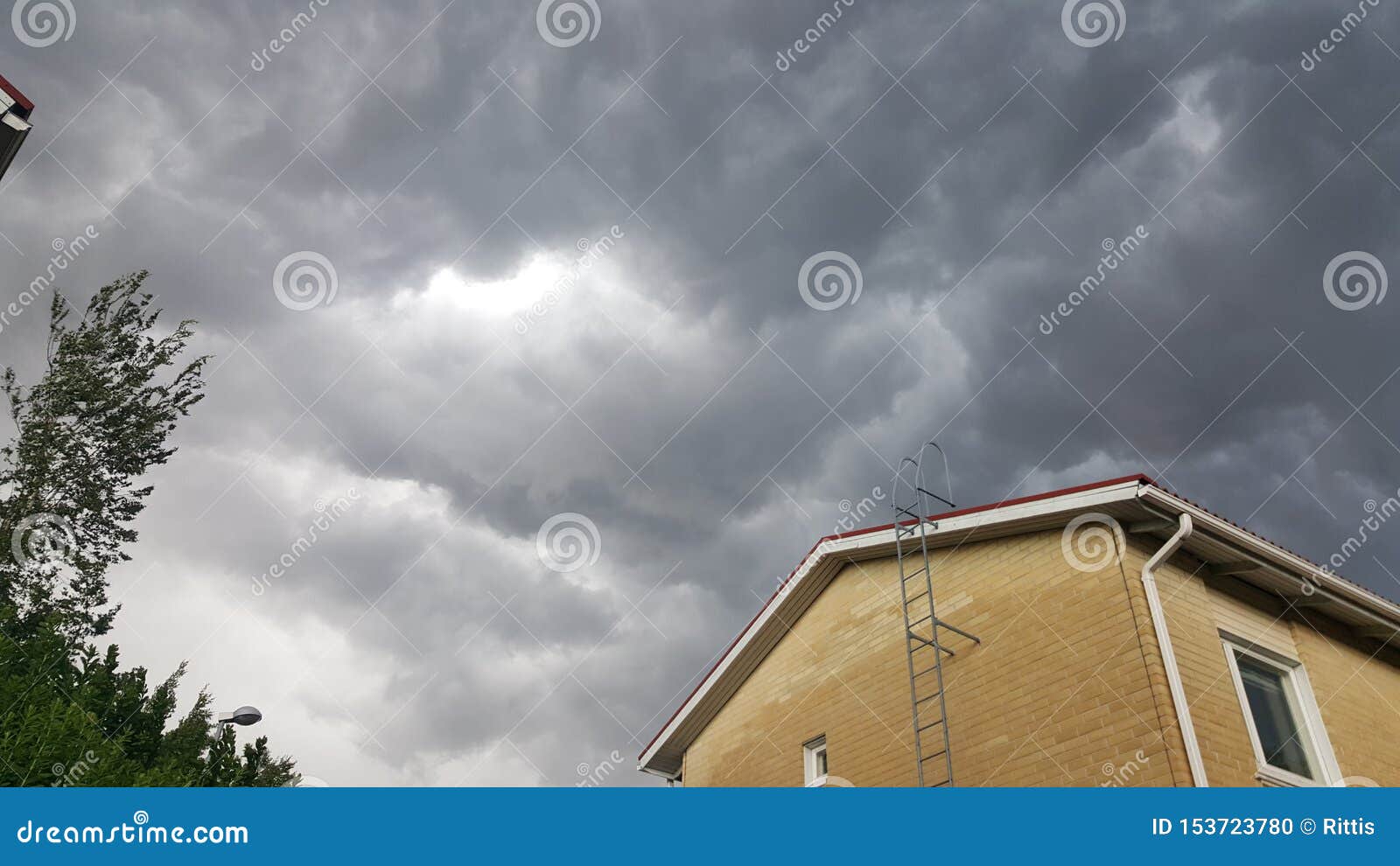 Thunderstorm with Dark Threatening Clouds Above a Building Stock Photo ...
