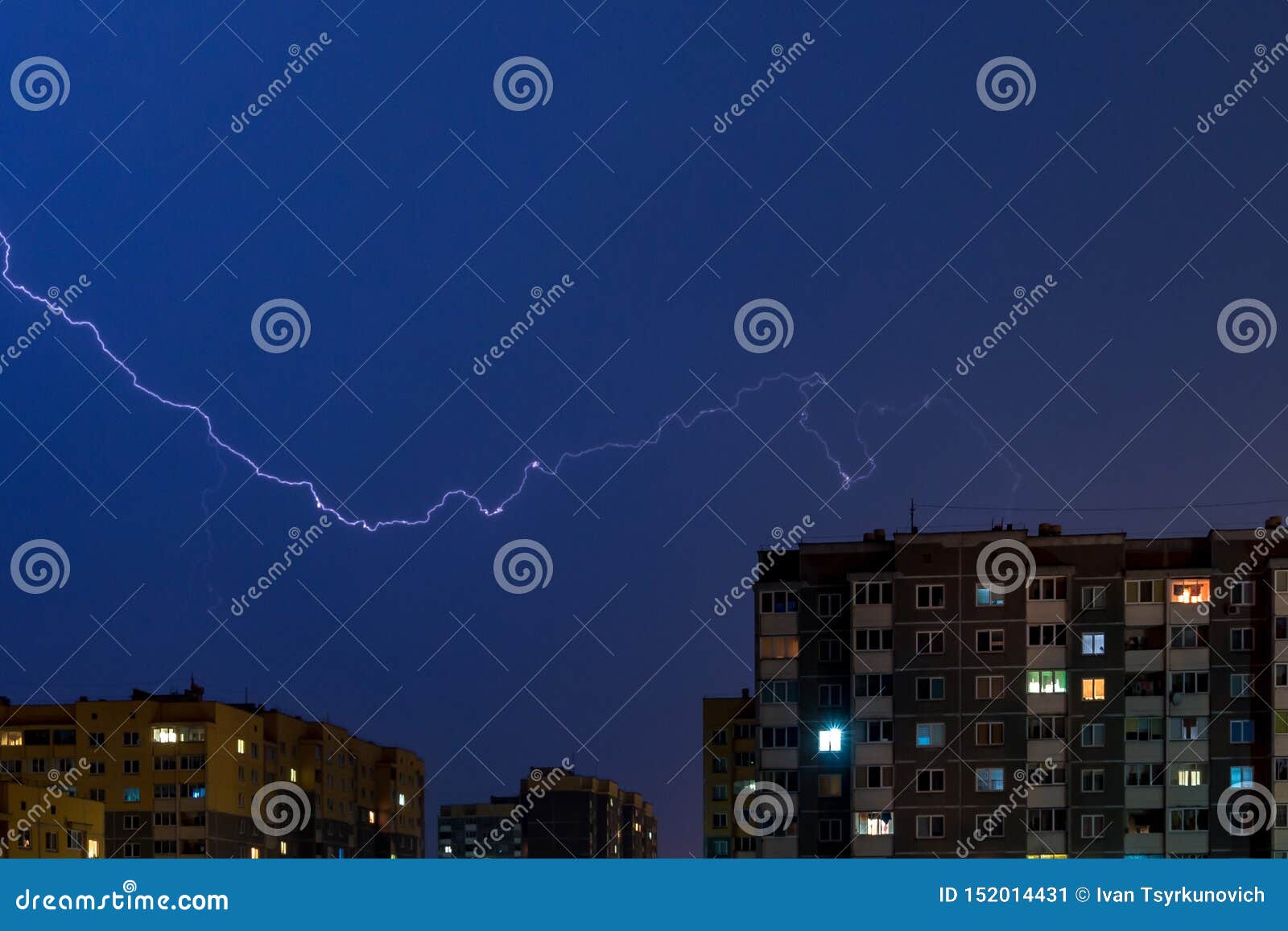 Thunderstorm with Lightning Bolt Strike Over City. Moment Lightning ...