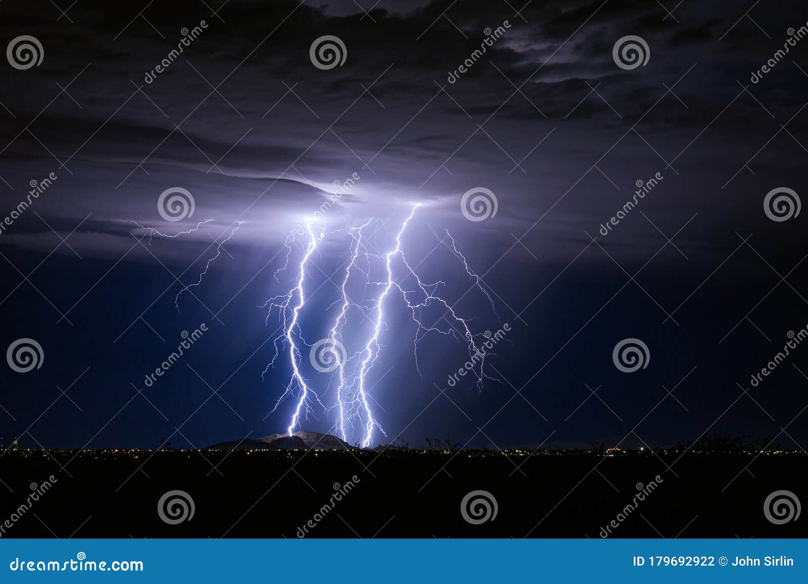 Thunderstorm with Lightning Bolt Strikes and Storm Clouds Over a City ...