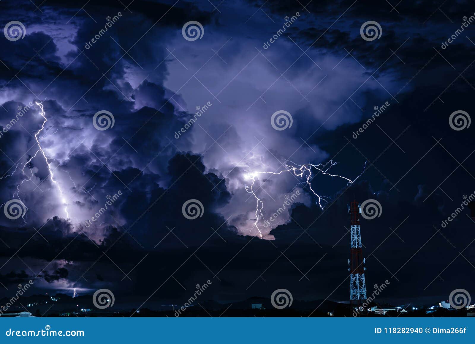 Forked Lightning Over the Cell Phone Antenna Tower at Night Stock Photo ...