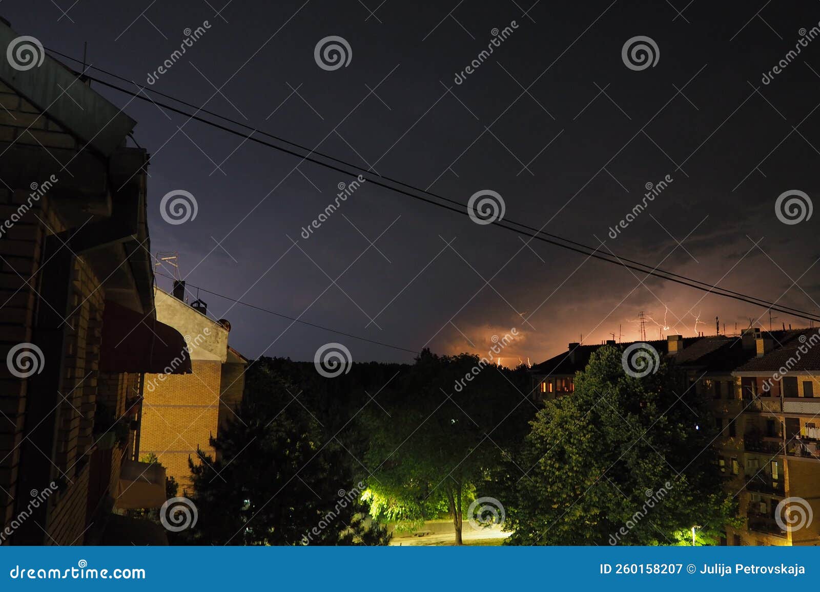 Thunderstorm at Night Over the City. Flashes of Lightning and Low Clouds. Thunder and Lightning ...