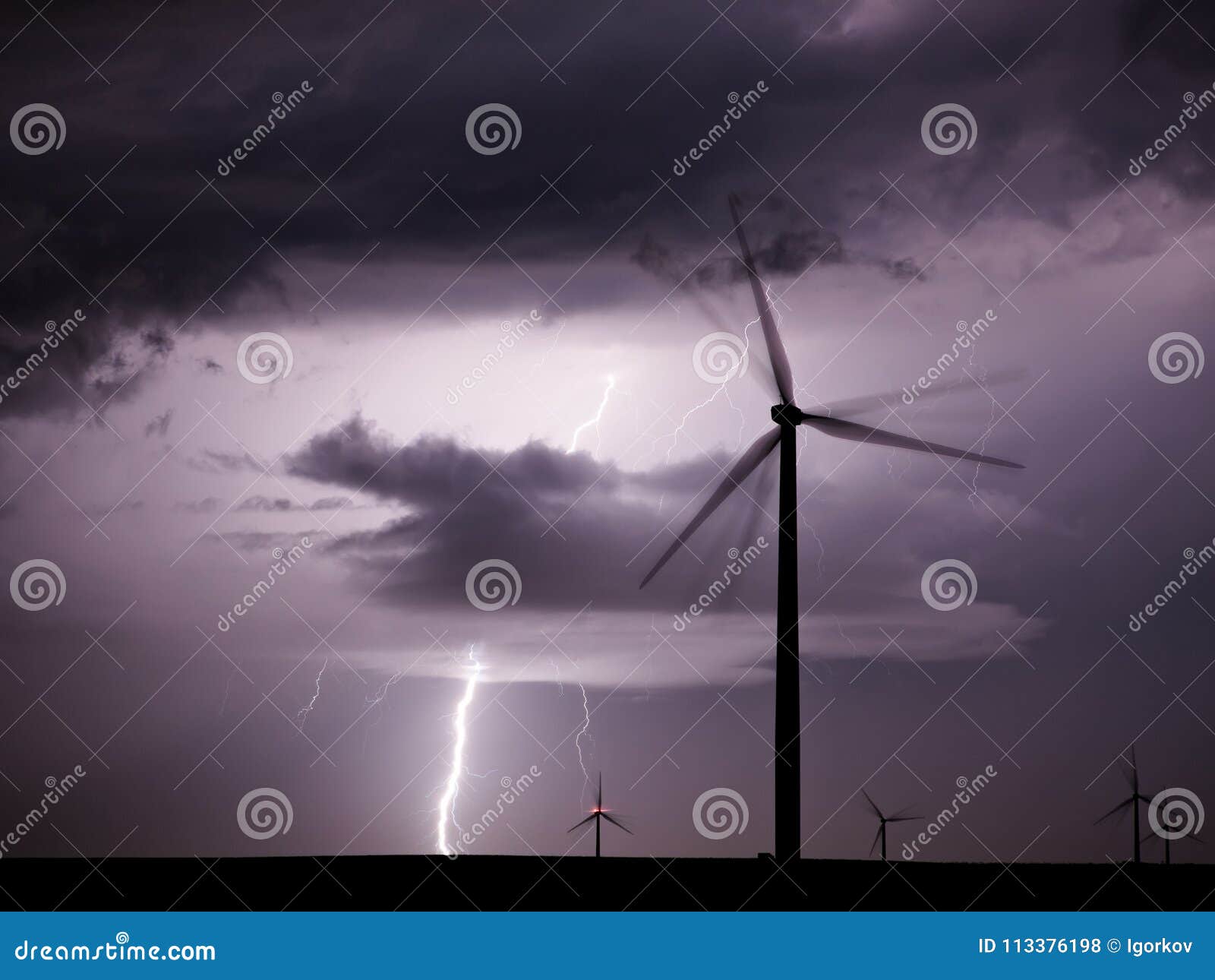 Thunderstorm Over a Wind Farm Representing Renewable Energy Stock Photo ...