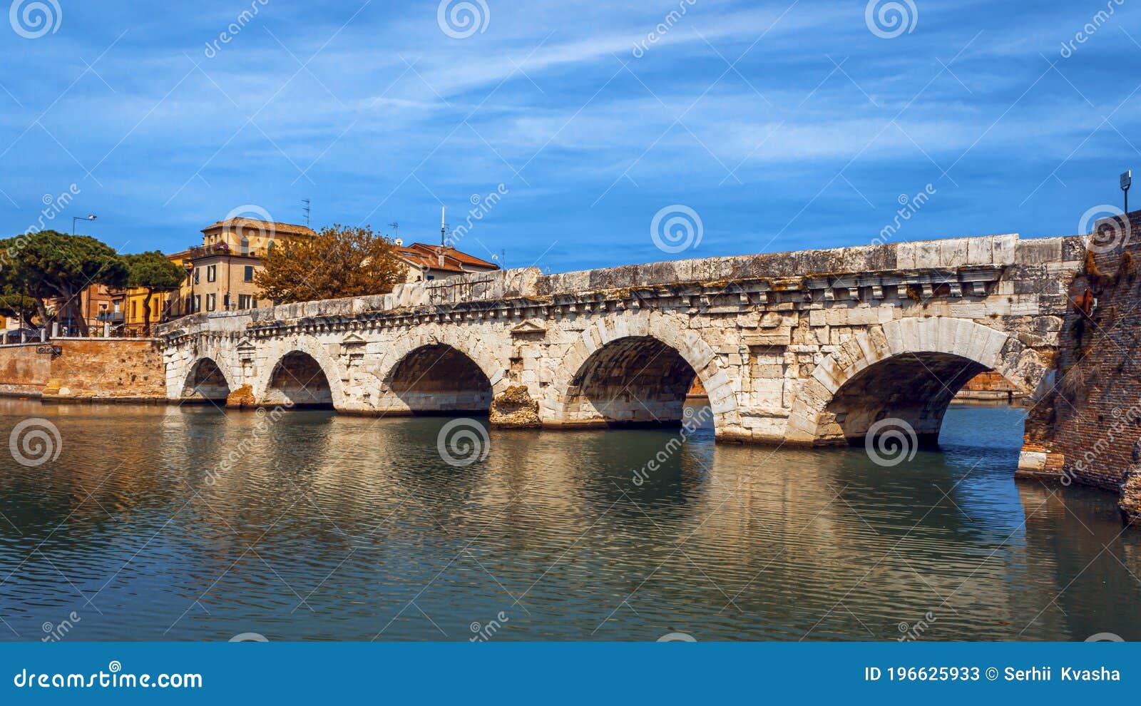 Tiberius Bridge in Rimini on a Background of Blue Sky with White Clouds ...