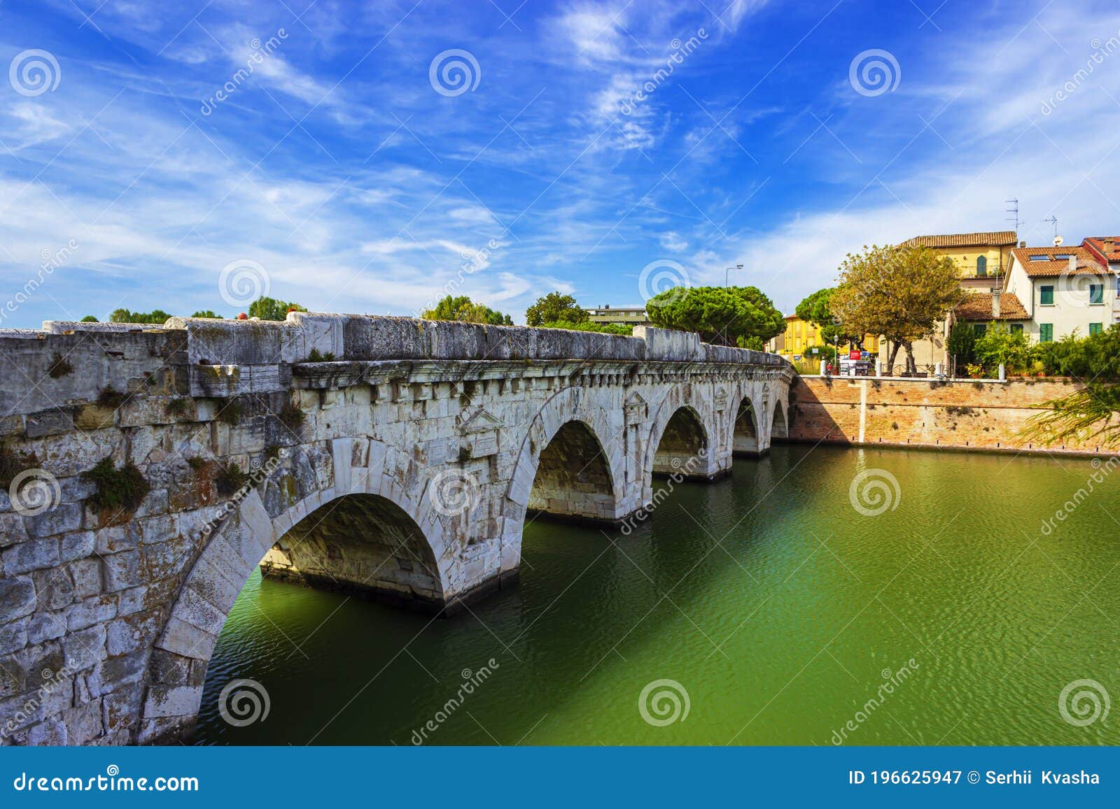 Tiberius Bridge in Rimini on a Background of Blue Sky with White Clouds ...
