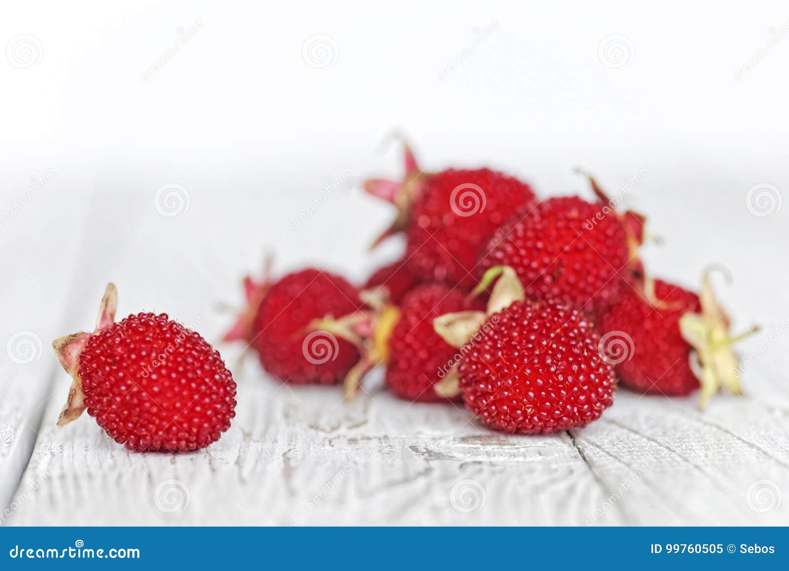 Tibetan Raspberry on a Rustic White Wooden Table. Red Berries on White ...