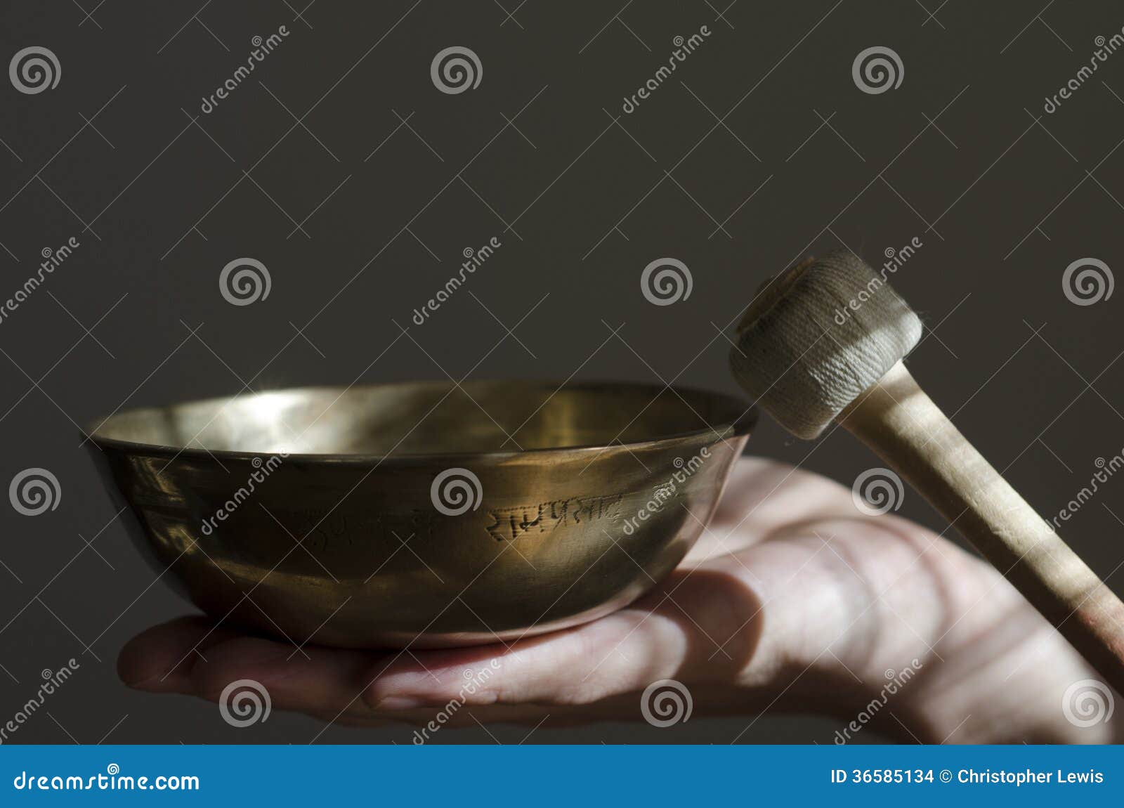 A Tibetan Singing Bowl Being Played with a Baton. Stock Photo - Image ...