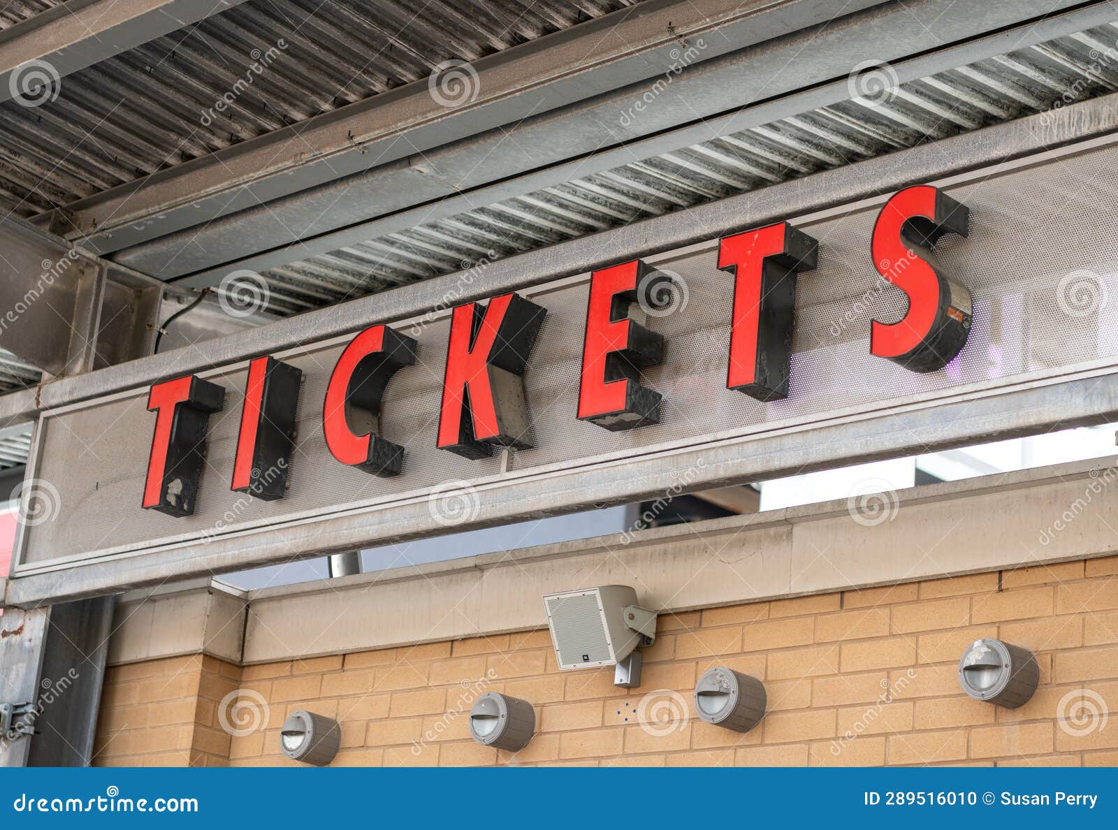 Tickets Sign in Red Letters on Building Stock Photo - Image of beige ...