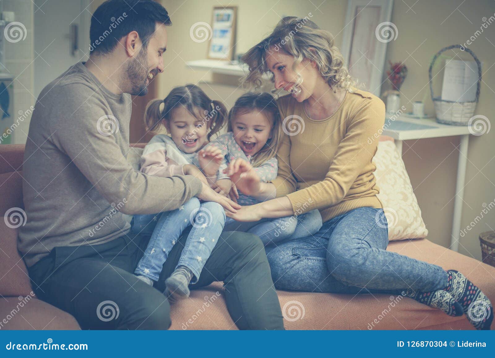 Tickling time. Lot of fun stock photo. Image of couch - 126870304