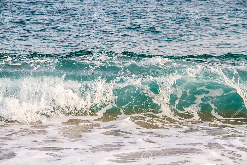 Tidal Bore. Blue Waves with Bats Rolling Onto a Sandy Beach Stock Photo ...