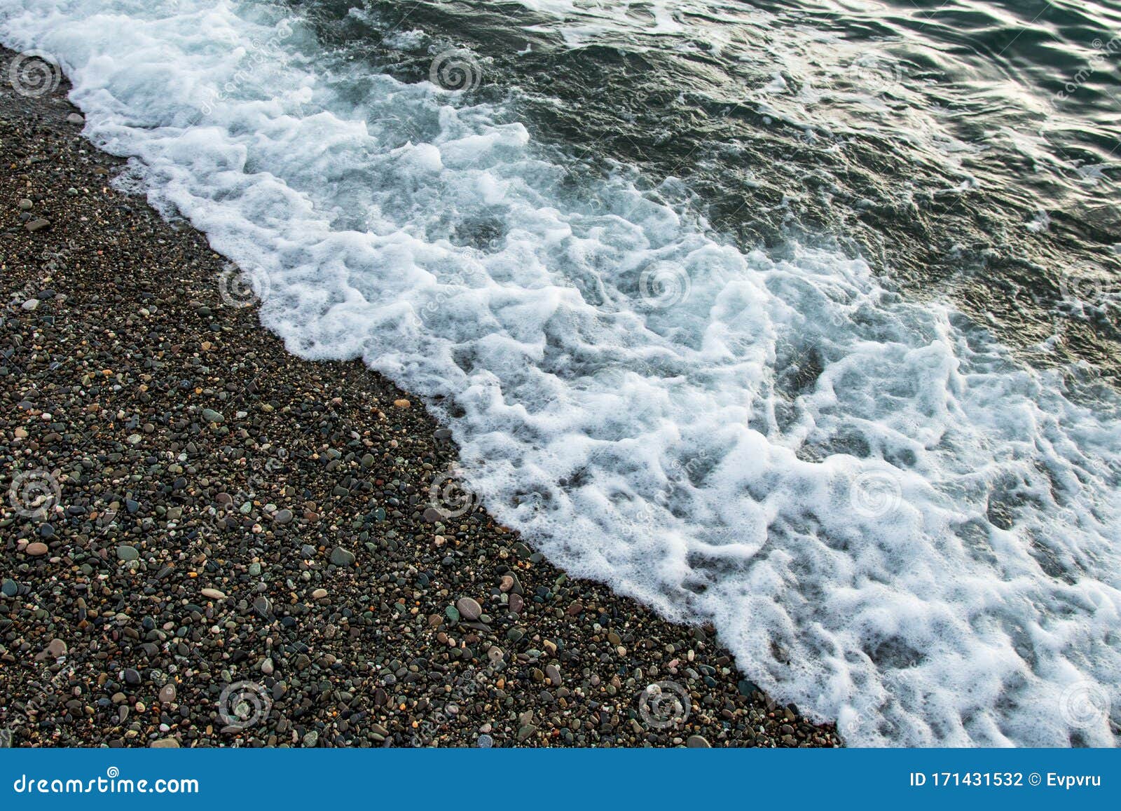 The Wave Rolls Onto the Seashore, Which is Covered with Small Stones ...