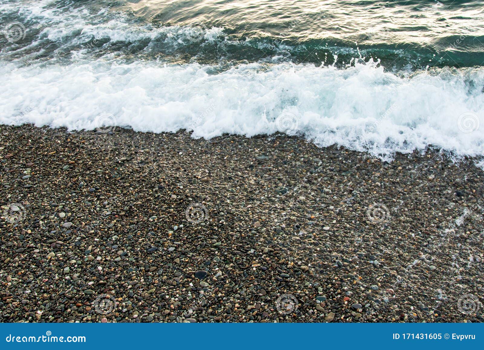 The Wave Rolls Onto the Seashore, Which is Covered with Small Stones ...