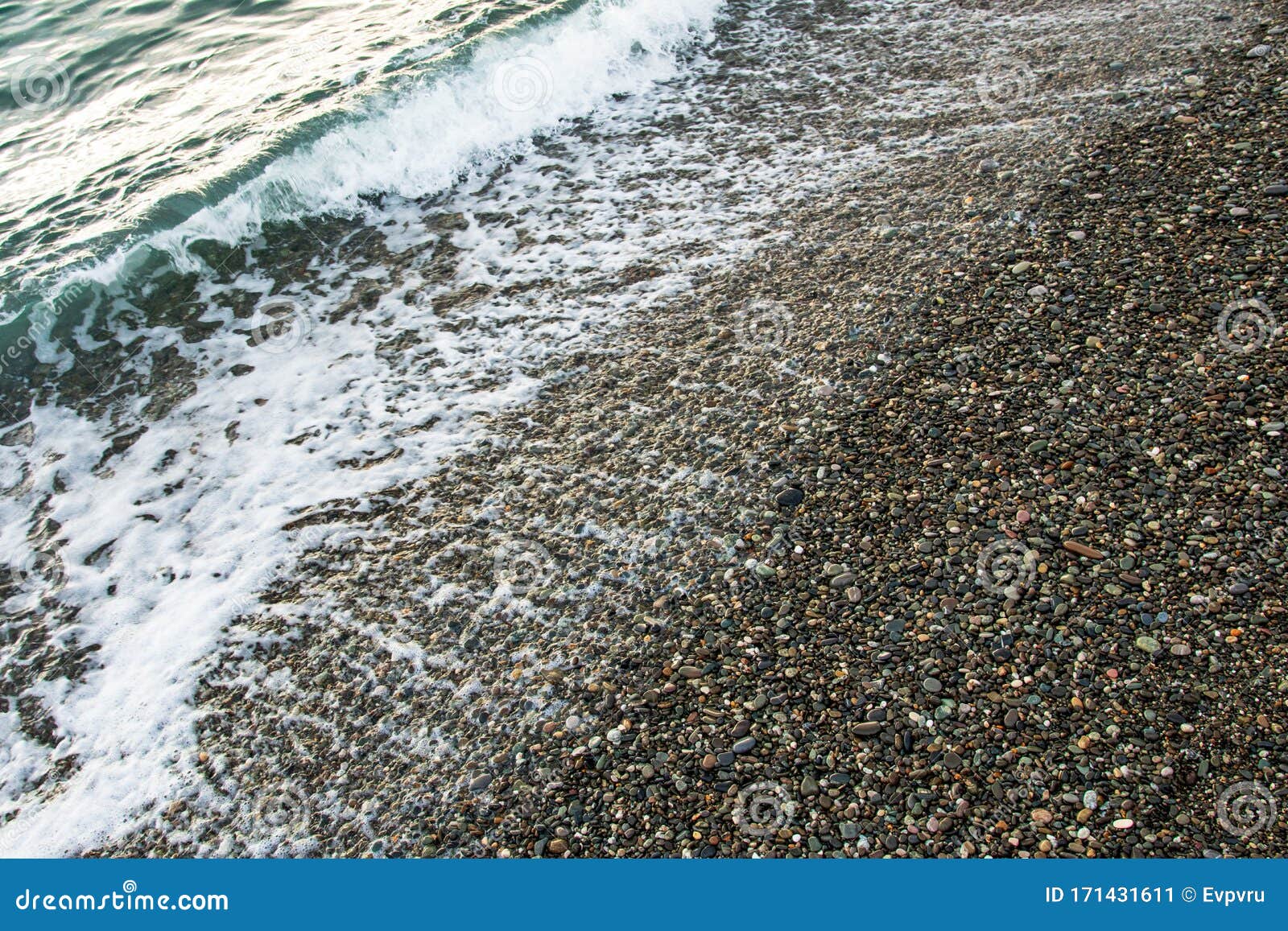 The Wave Rolls Onto the Seashore, Which is Covered with Small Stones ...