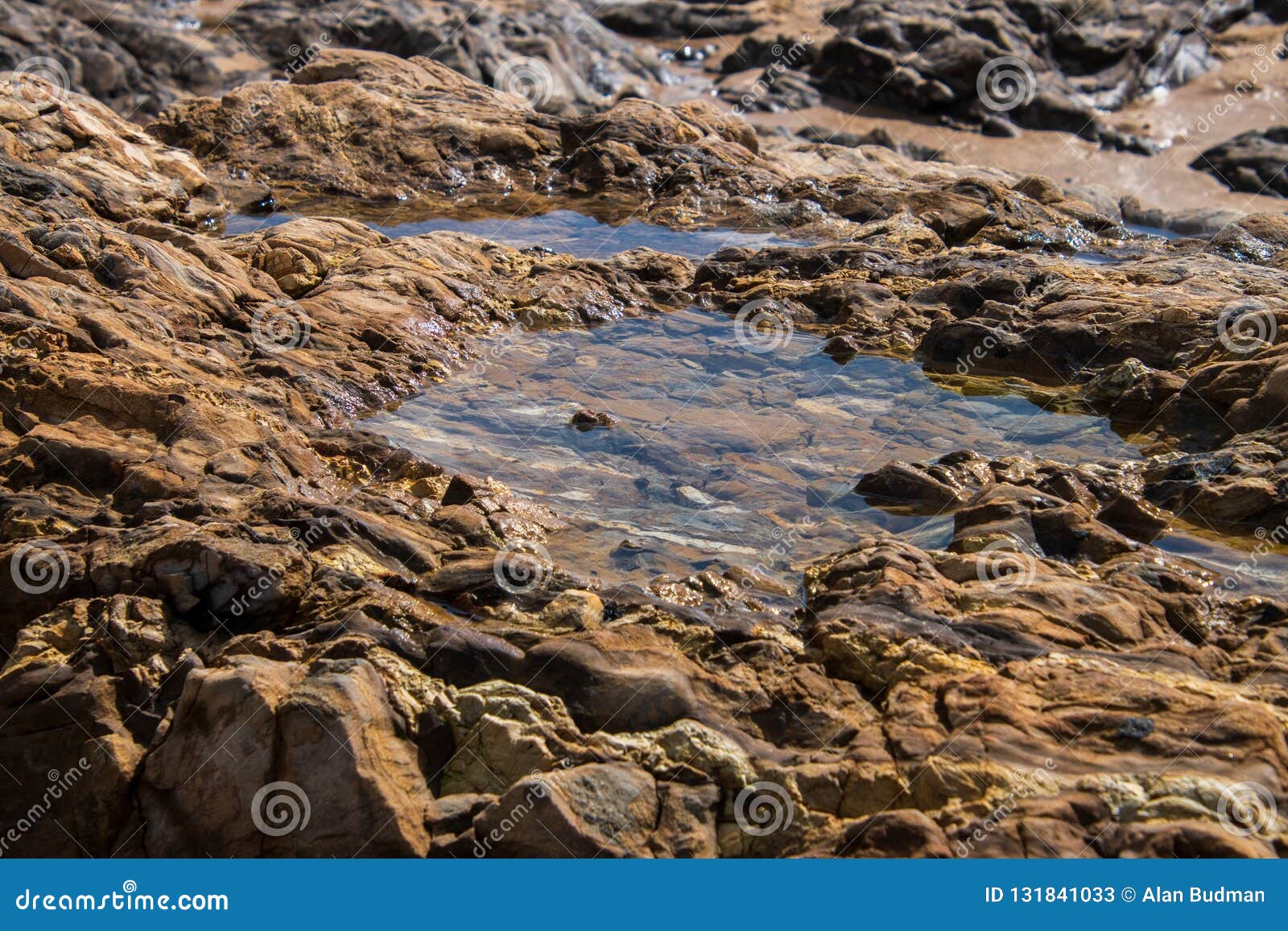 Tidal Pool on Brown Rough Rock Formation by the Ocean Stock Image ...