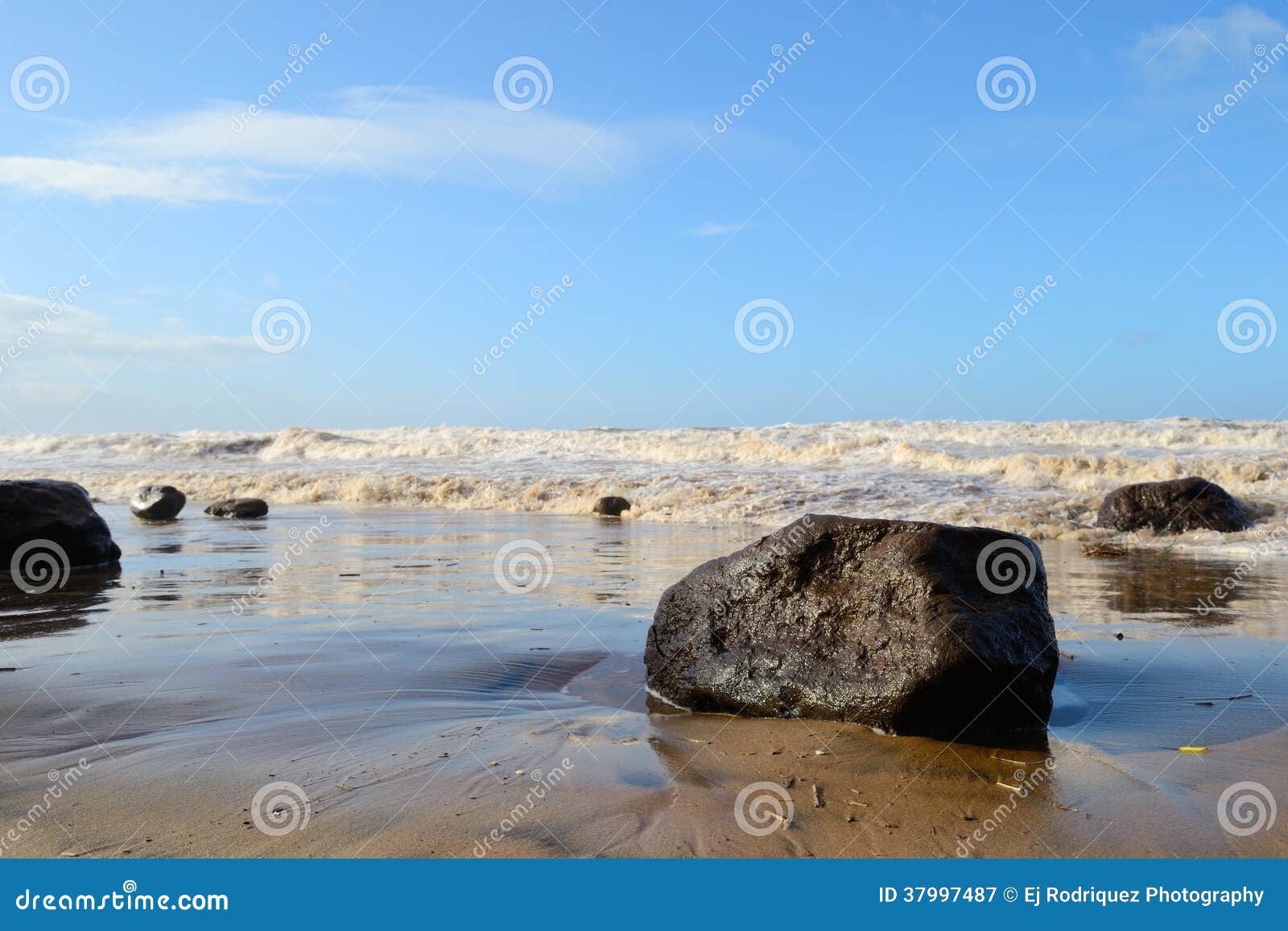 Tide gently rolling in. stock image. Image of color, black - 37997487