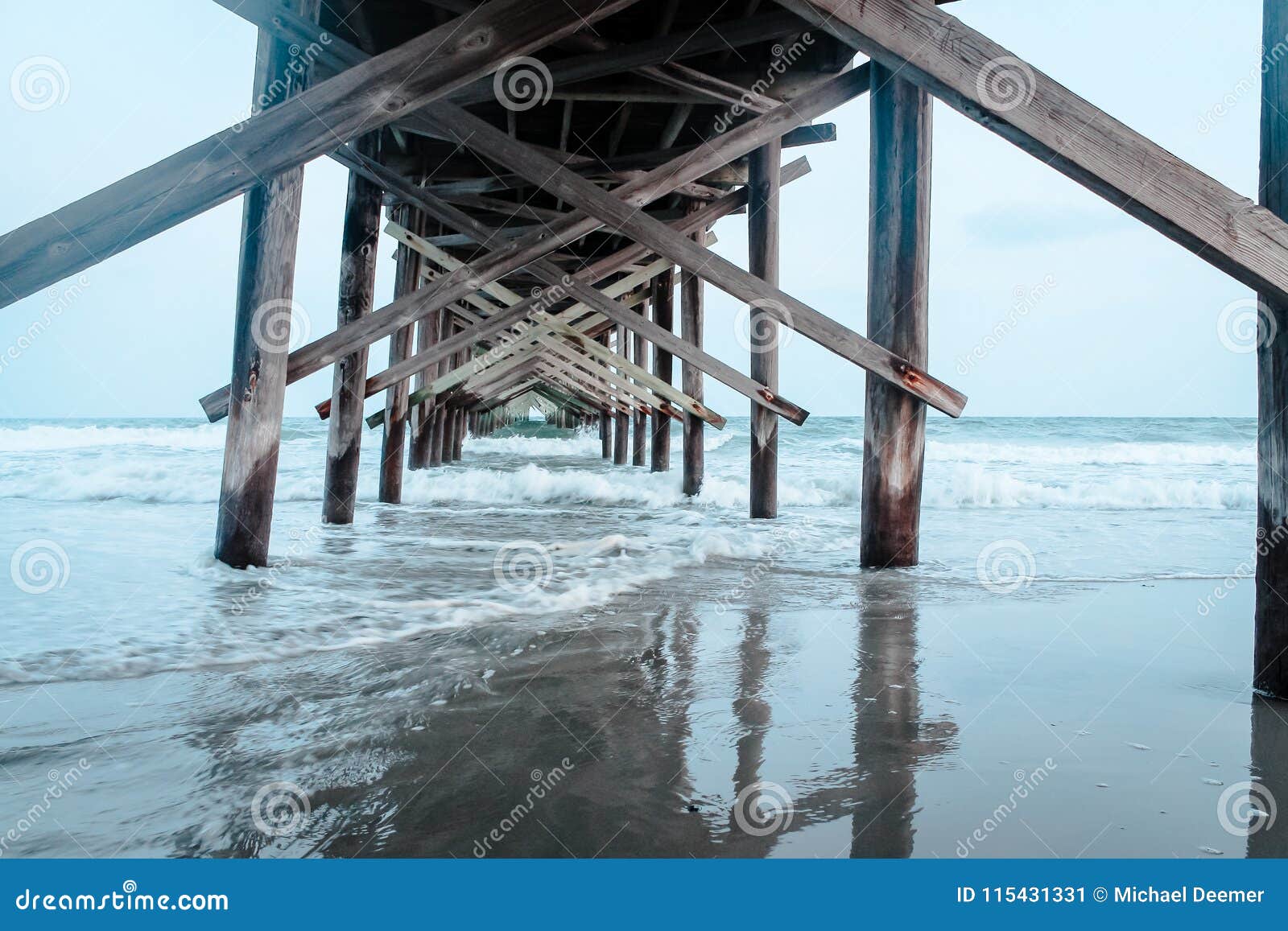 The Tide Going Back Out from Under the Pier Stock Image - Image of ...