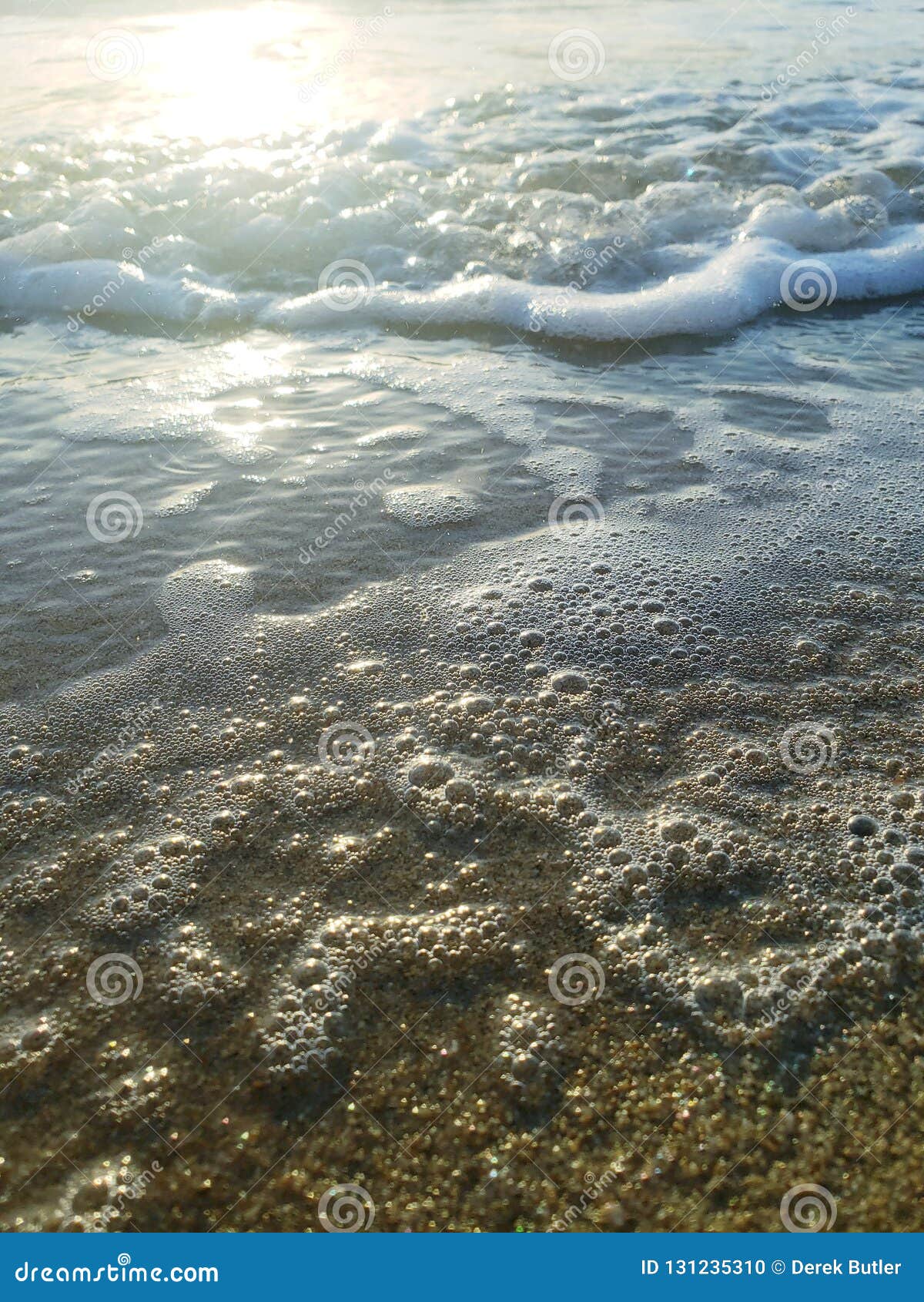Tide rolling in stock photo. Image of tide, reflection - 131235310