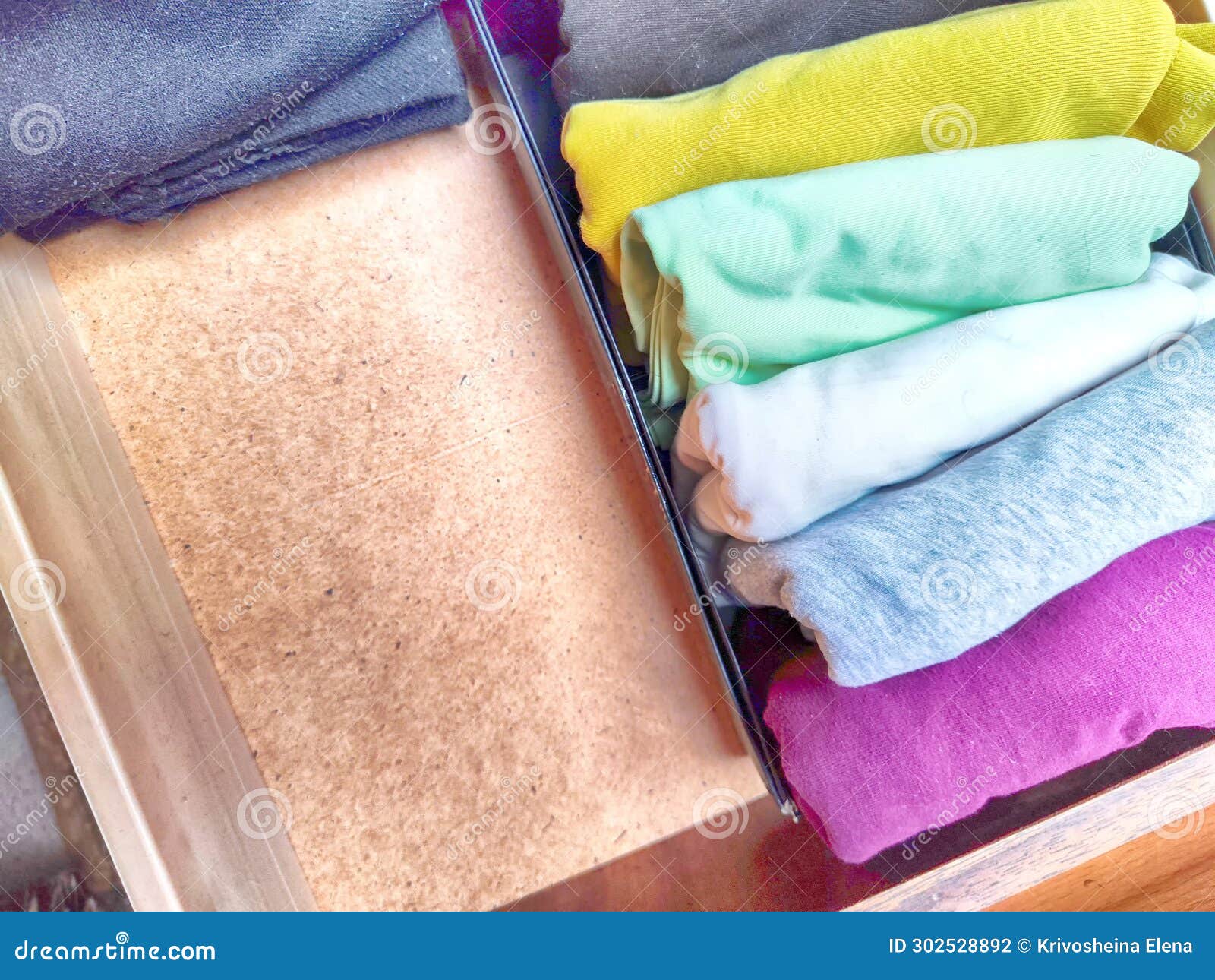 Tidy and Organized Clothes with the Konmari Method. Storage of T-shirts ...