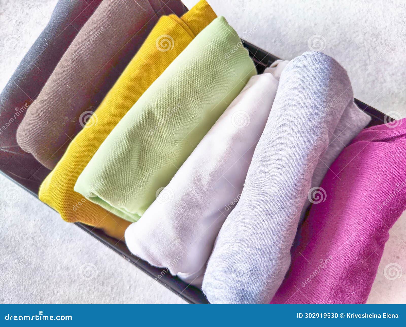 Tidy and Organized Clothes with the Konmari Method. Storage of T-shirts ...