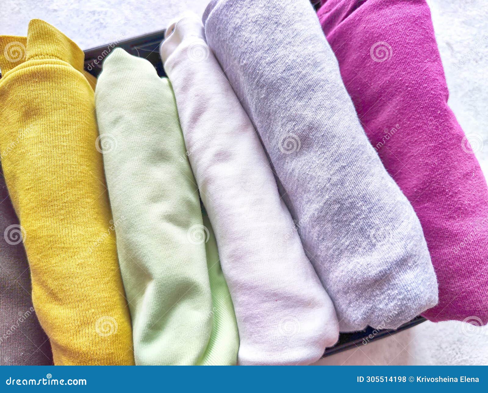 Tidy and Organized Clothes with the Konmari Method. Storage of T-shirts ...