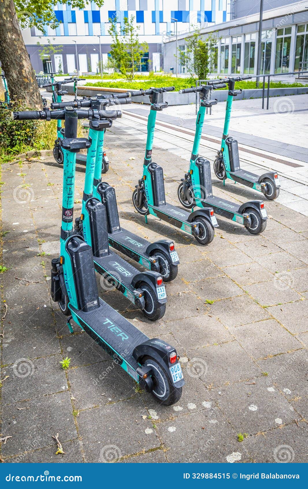 Tier Rental Electric Scooters Parked in Front of City Modern Building ... Tier Rental Electric Scooters Parked in Front of City Modern Building ...