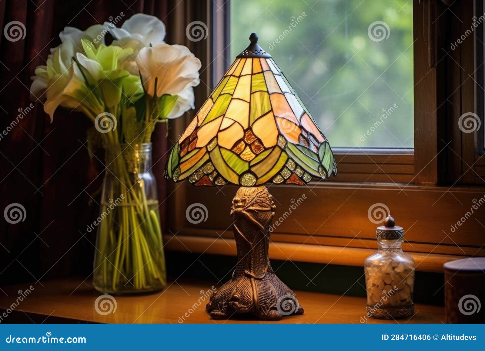 Tiffany-style Stained Glass Lamp on Windowsill Stock Photo - Image of ...