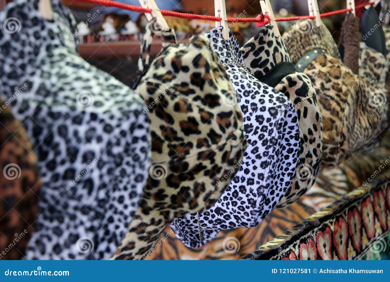 Tiger Pattern Fabric of Cap and Hat Hanging on the Line. Stock Image ...