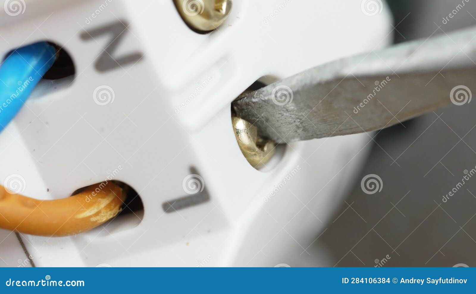 Tightening the Socket Terminals with a Screwdriver. Stock Photo - Image ...
