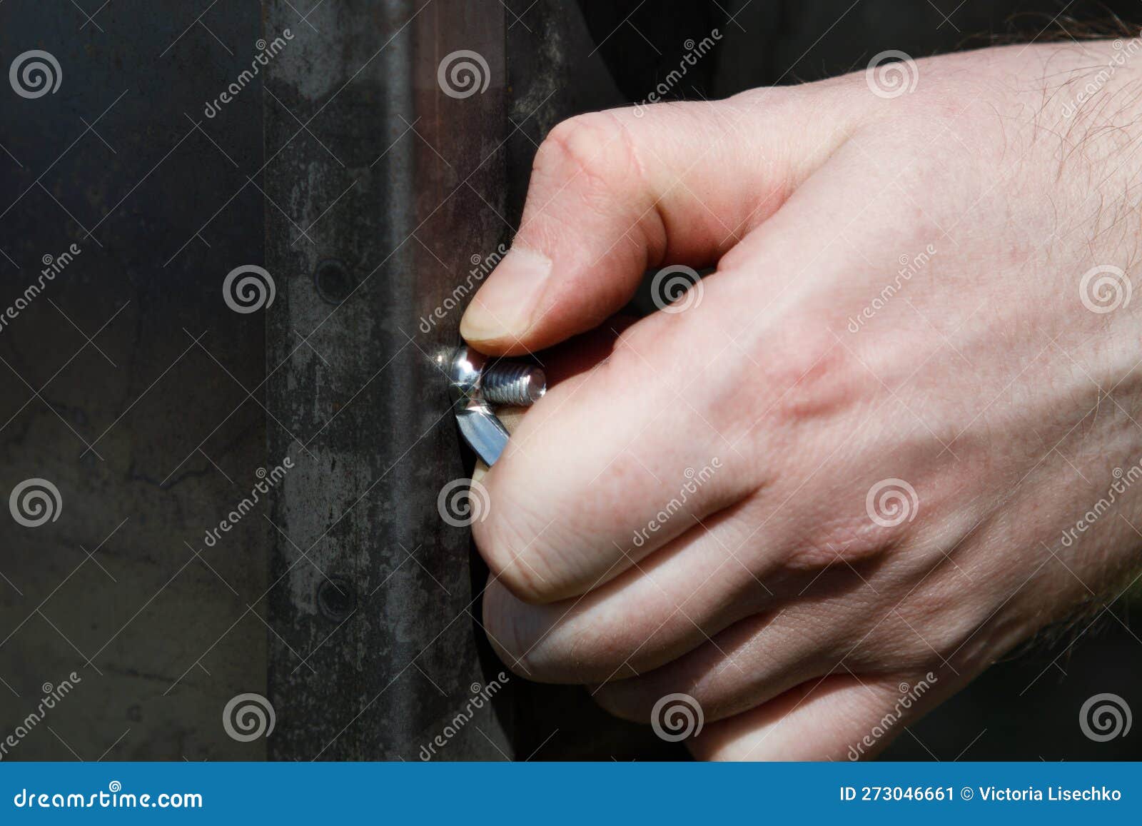 Tightening Up a Nut by Hand. Close Up. Stock Image - Image of close ...